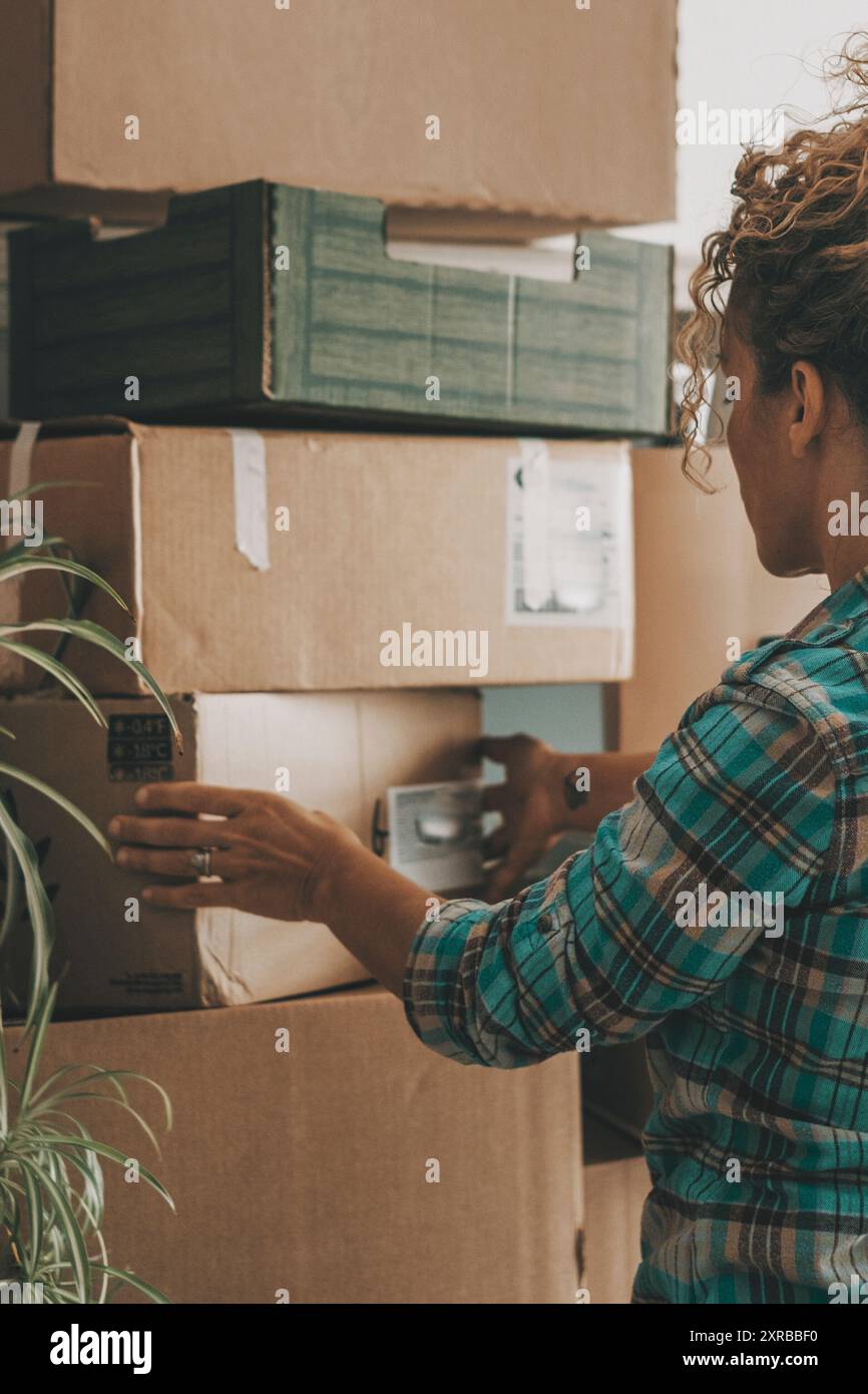 Independent lifestyle female people relocating house moving boxes ...