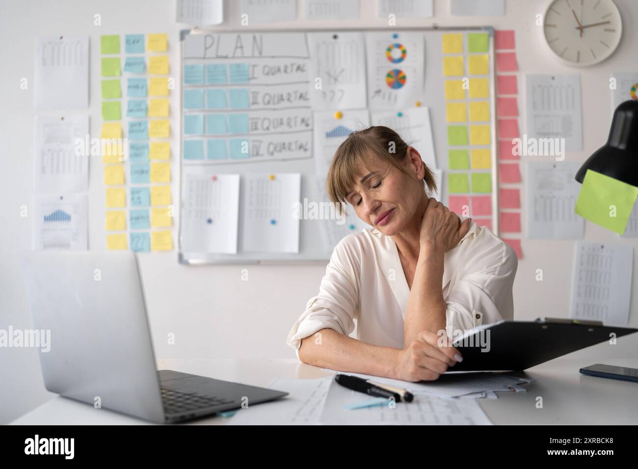 Old employee suffering from hi-res stock photography and images - Alamy