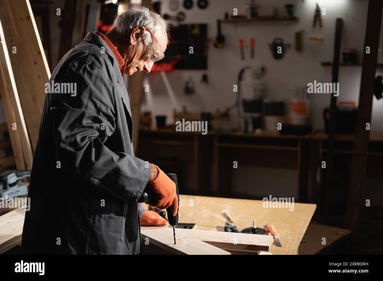 Senior worker using tools hi-res stock photography and images - Alamy