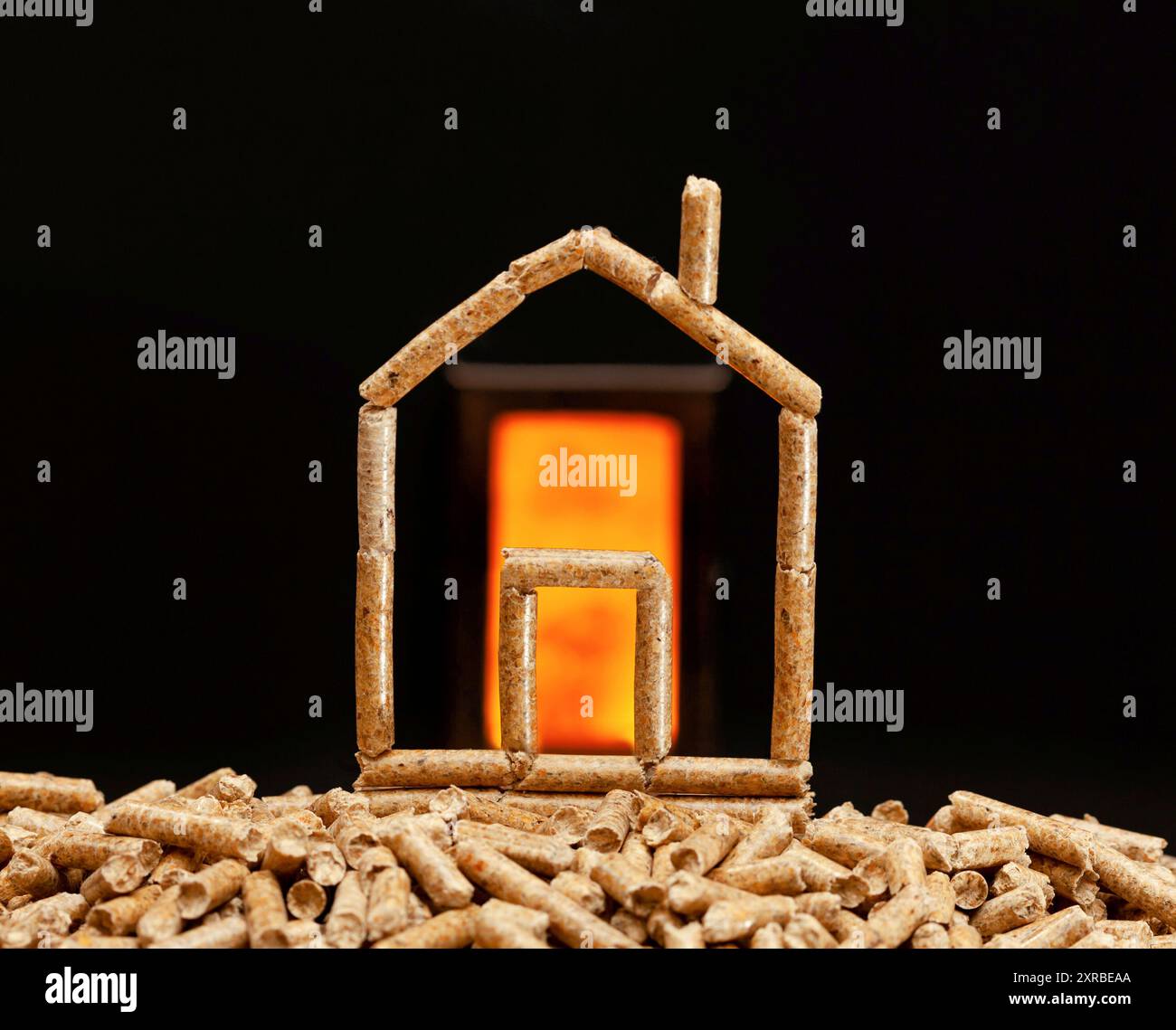 Miniature house made with wood pellets. Heating concept with combustion ...
