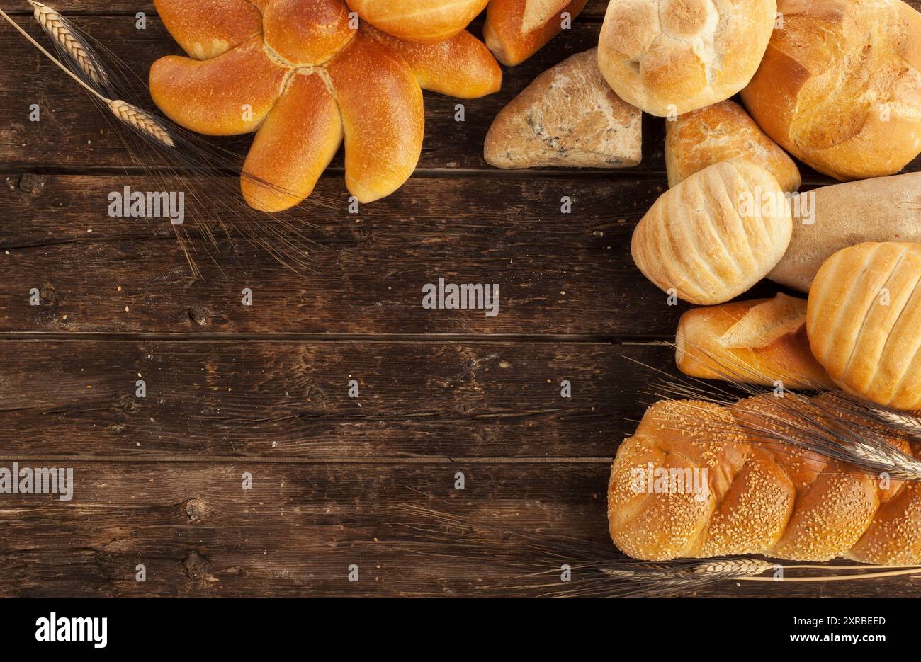Variety types of bread on wood table Stock Photo - Alamy