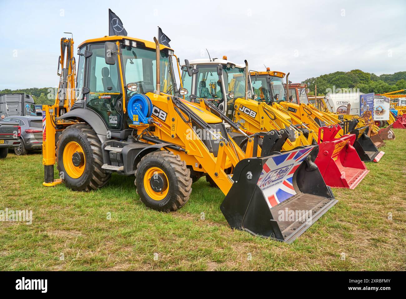 Line up of old diggers at a festival Stock Photo - Alamy