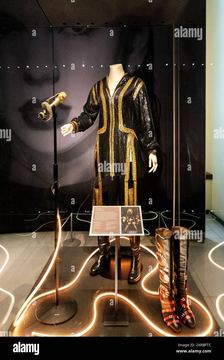 Sequined dress by Jessica Jones and Christian Louboutin boots worn at ...