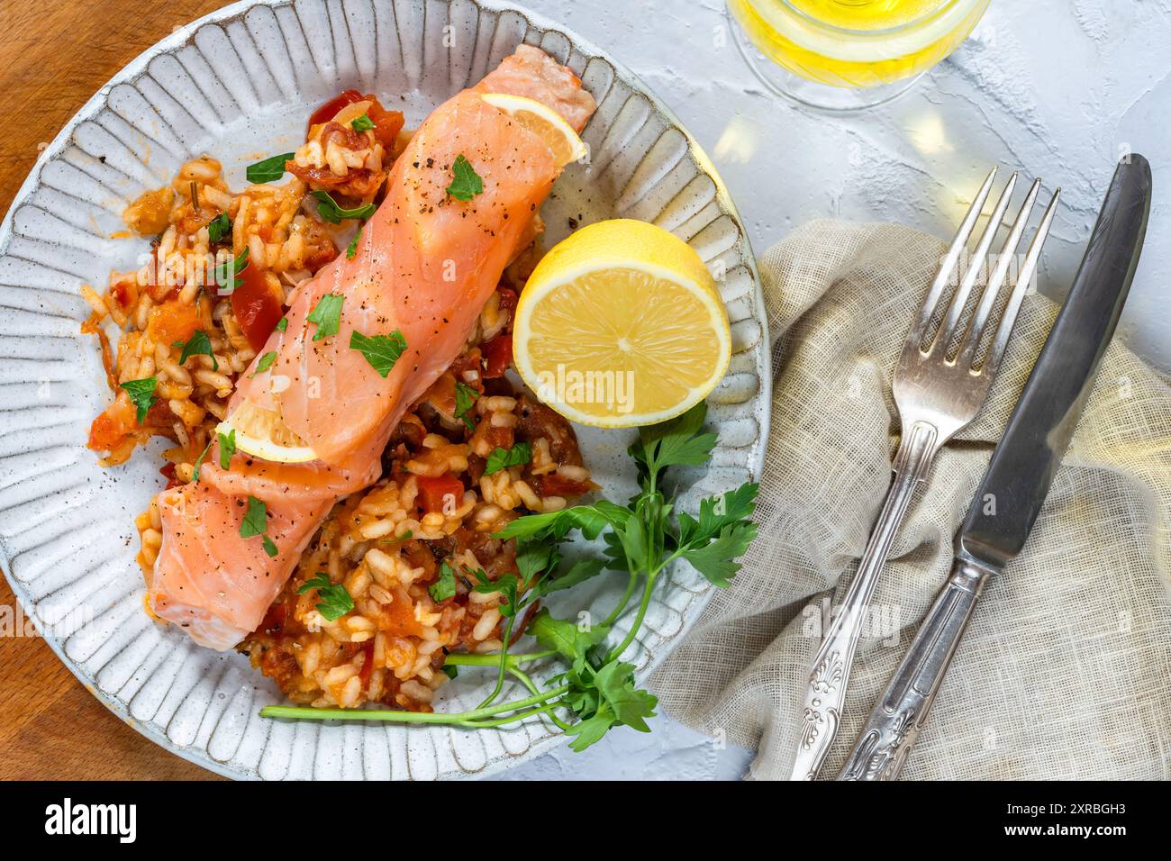 Baked salmon with chorizo rice Stock Photo - Alamy