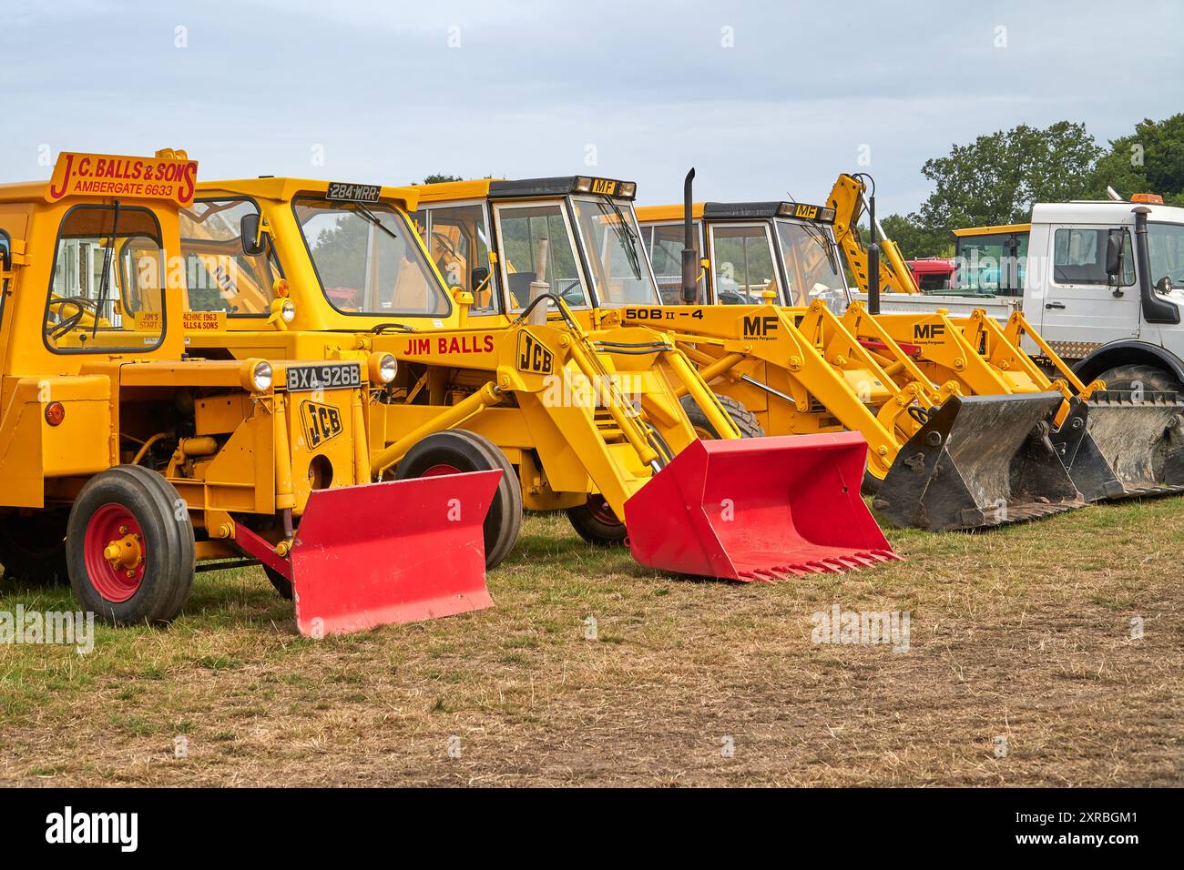 Line up of old diggers at a festival Stock Photo - Alamy