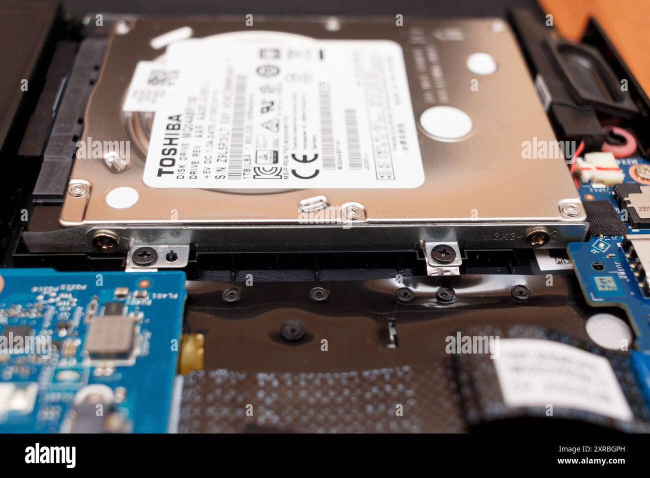 Iserlohn, NRW, Germany. 09th of 2024. Hard drive inserted into laptop ...