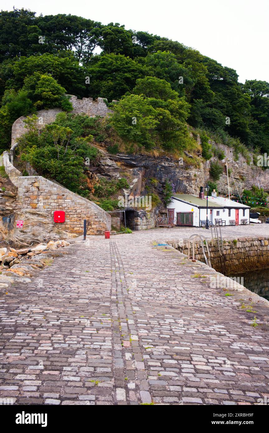 The outer habour at Dysart in Fife Scotland with tunnel under the cliff ...