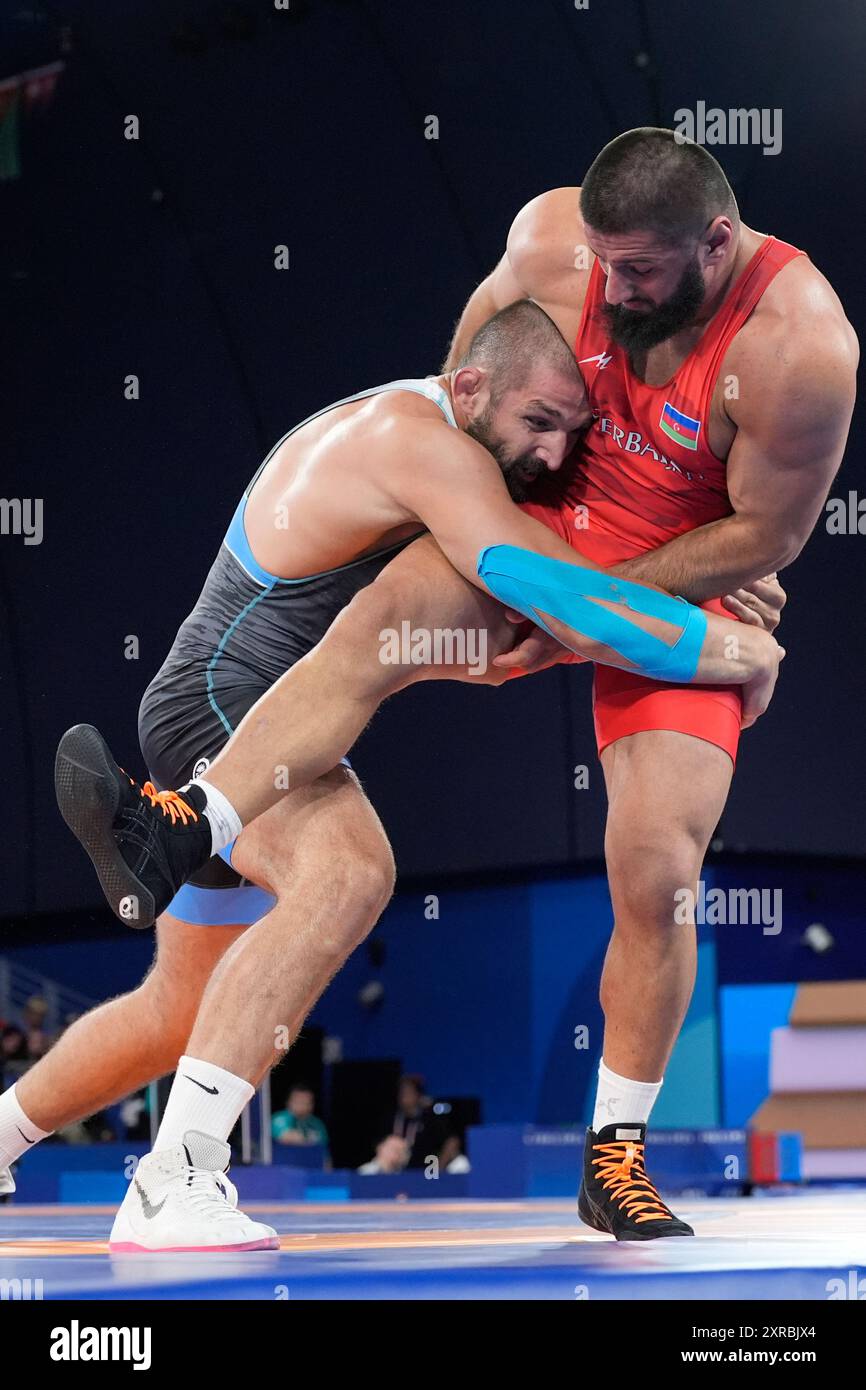 Azerbaijan's Giorgi Meshvildishvili, in red, and Georgia's Geno Petriashvili compete during ...