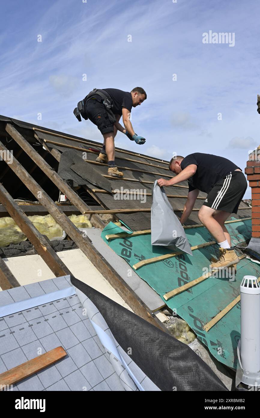 Roofing work, removing old felt and replacing with new breather ...
