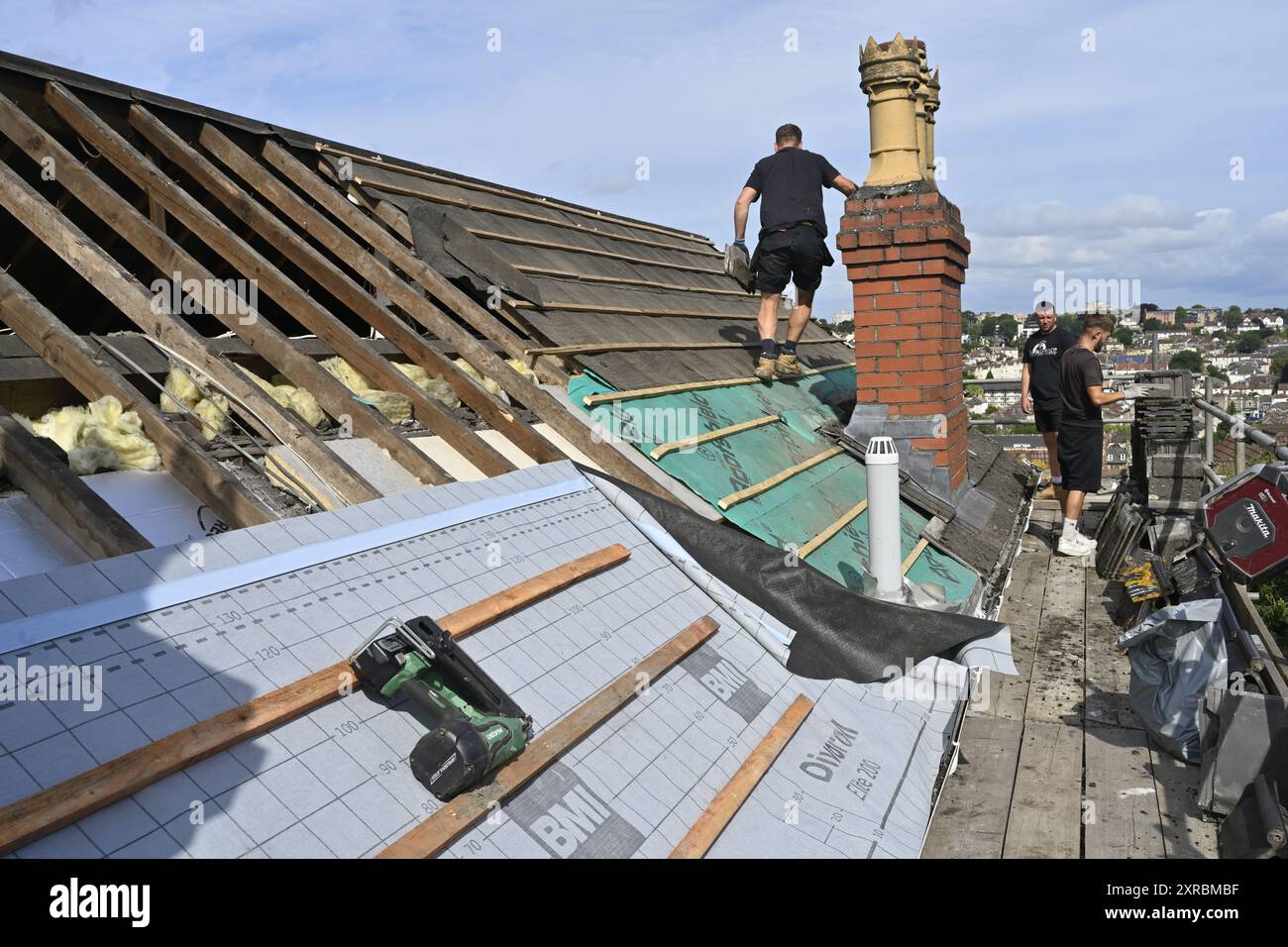 Roofing work, removing old felt and replacing with new breather ...