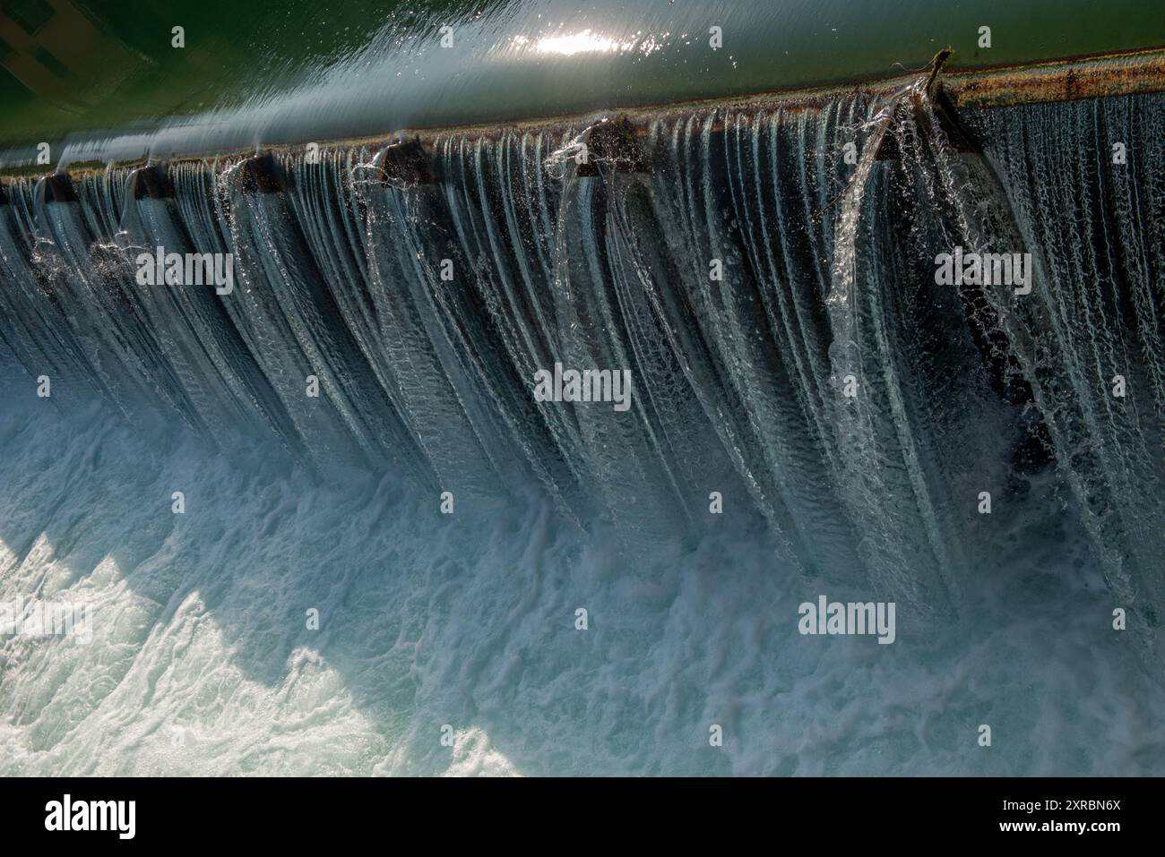 Dam with sluice gates for regulating the flow of the river Stock Photo ...