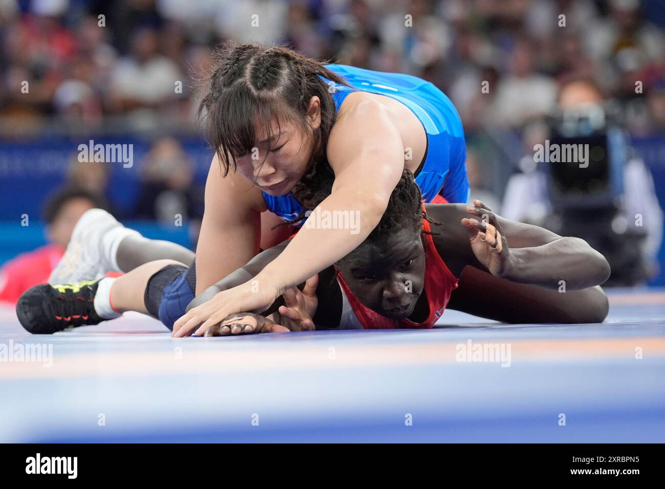 Norway's Grace Jacob Bullen and Japan's Sakura Motoki, in blue, compete ...