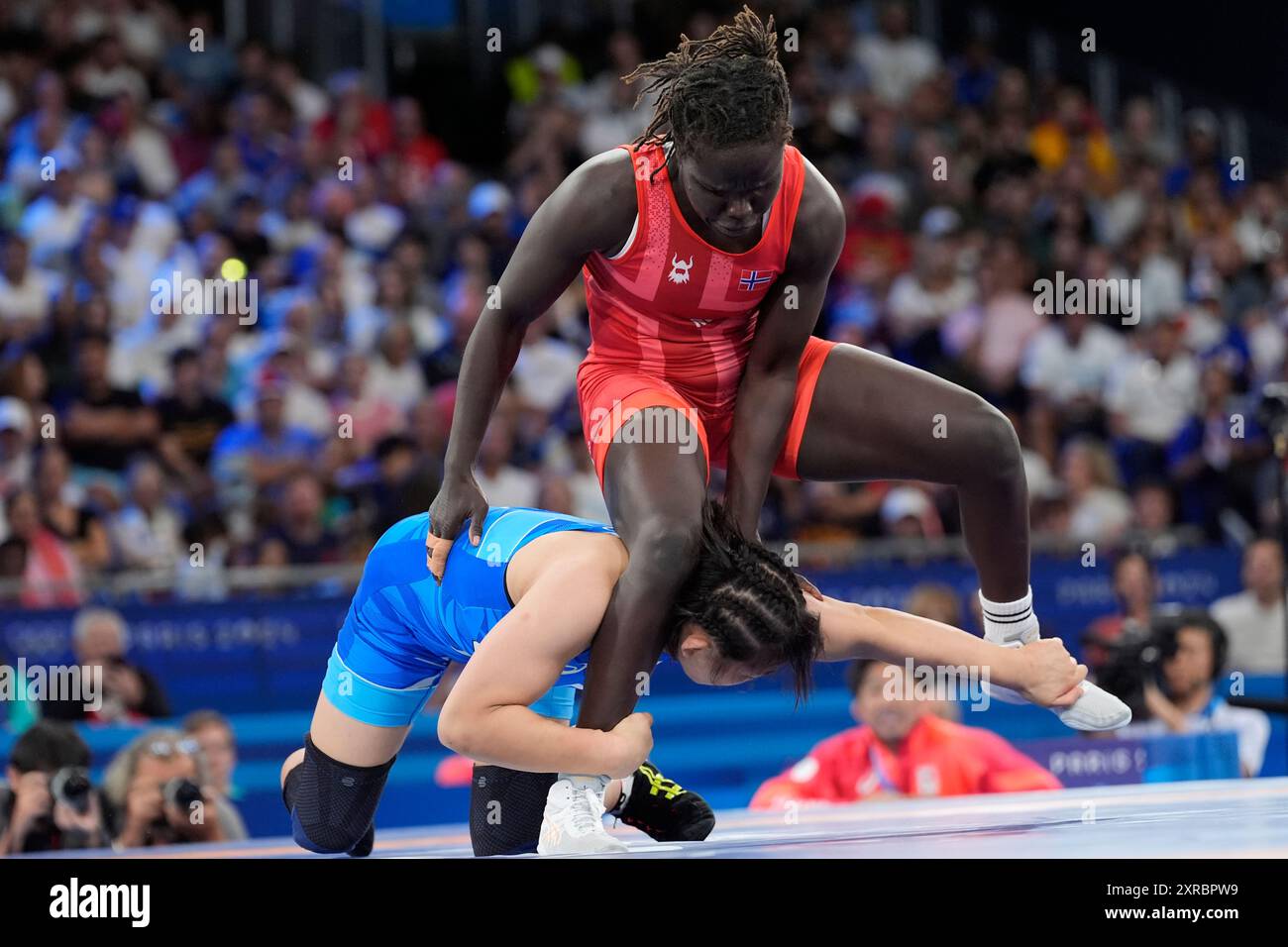 Norway's Grace Jacob Bullen and Japan's Sakura Motoki, in blue, compete ...