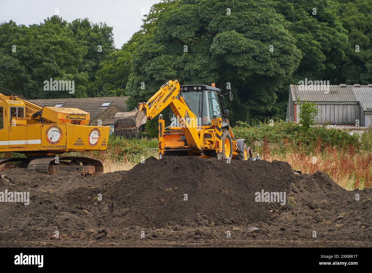 Earth moving machines at work Stock Photo - Alamy