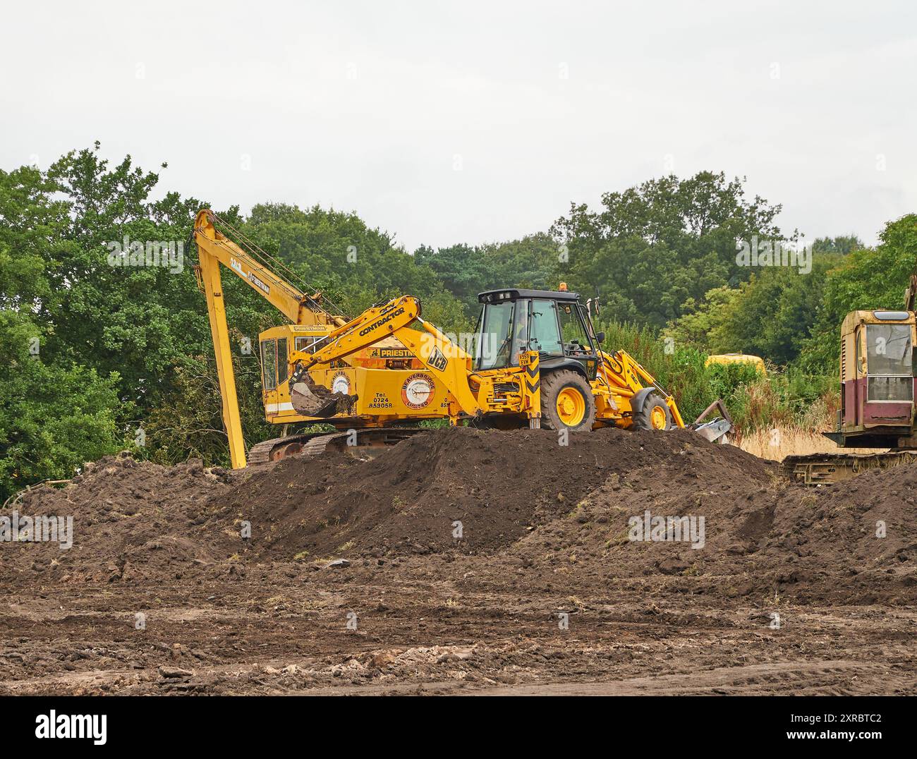 Earth moving machines at work Stock Photo - Alamy