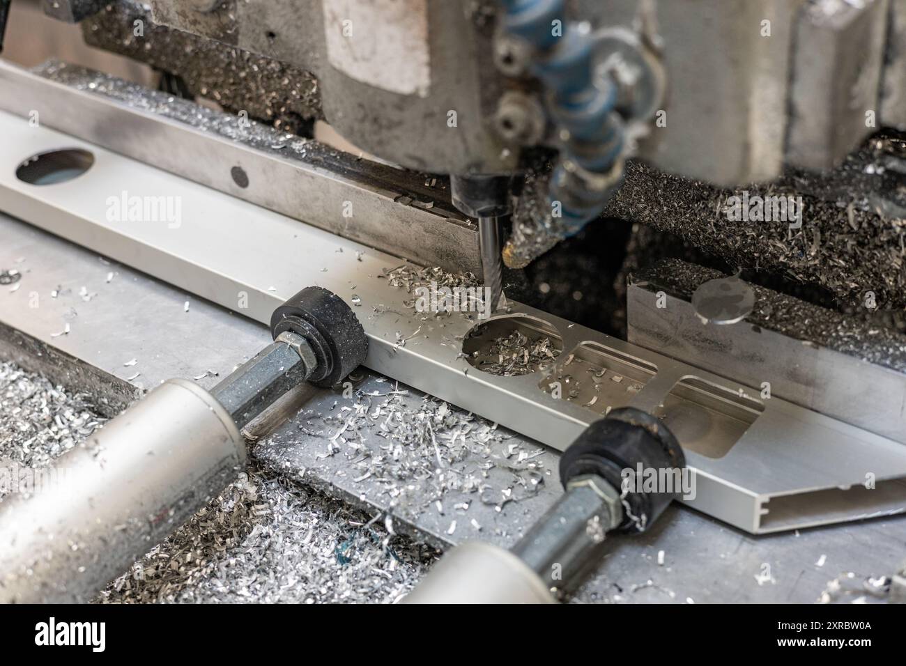 Milling holes in aluminum profiles Stock Photo - Alamy