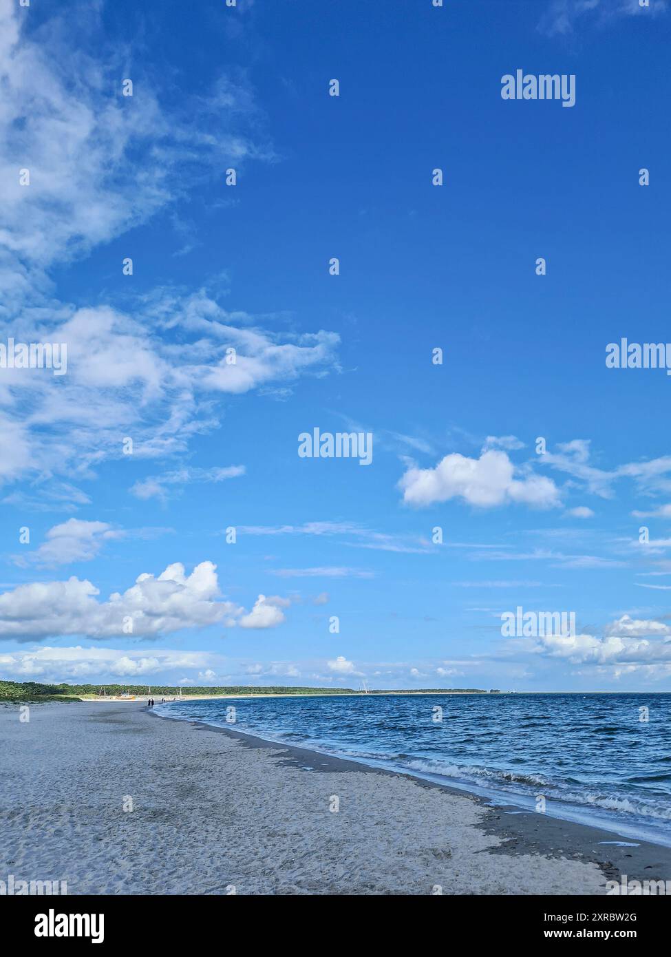 View of the sea with sun and shade on a summer's day at the water's ...