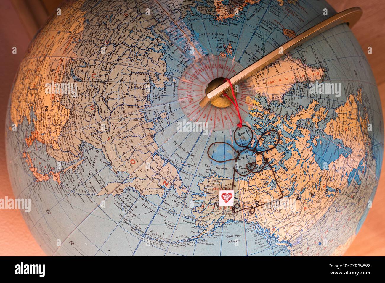 An old-fashioned globe with wire figure Stock Photo - Alamy