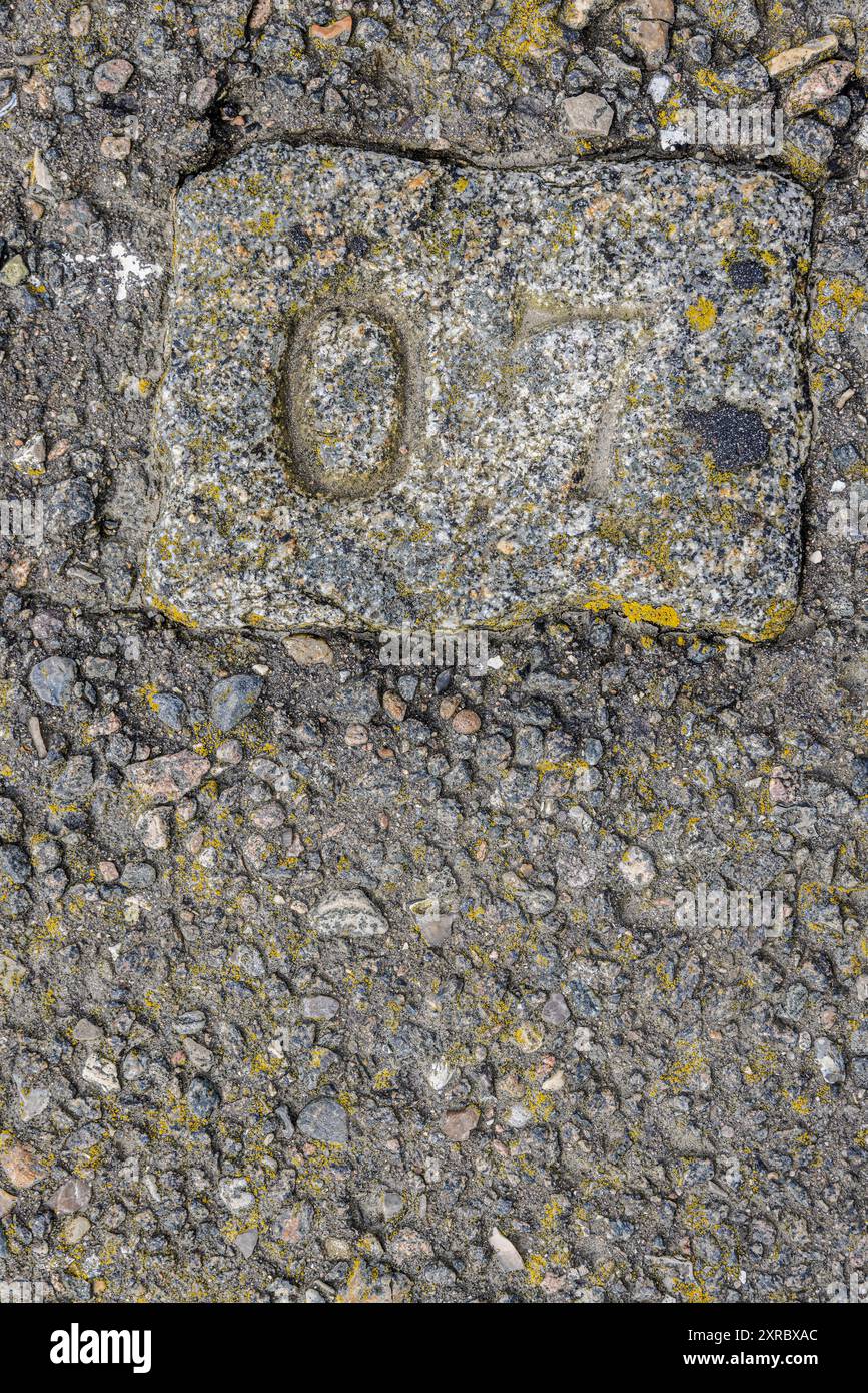 A sidewalk marking with the number 07 carved in stone, close-up Stock ...