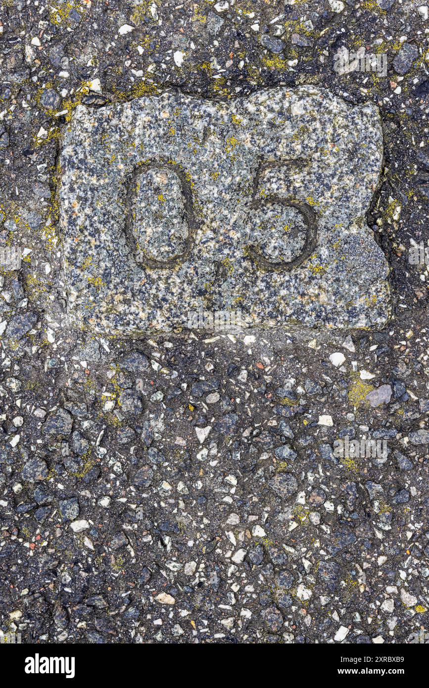 A sidewalk marking with the number 05 carved in stone, close-up Stock ...