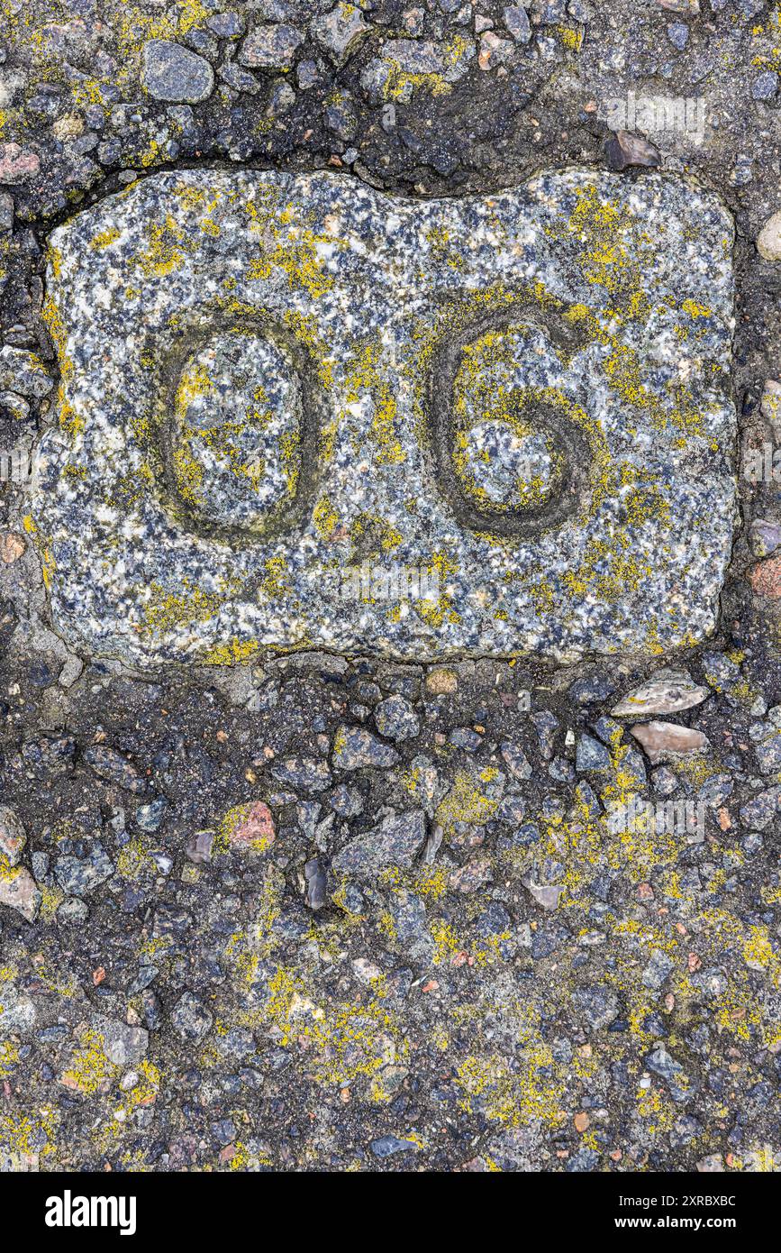 A sidewalk marking with the number 06 carved in stone, close-up Stock ...