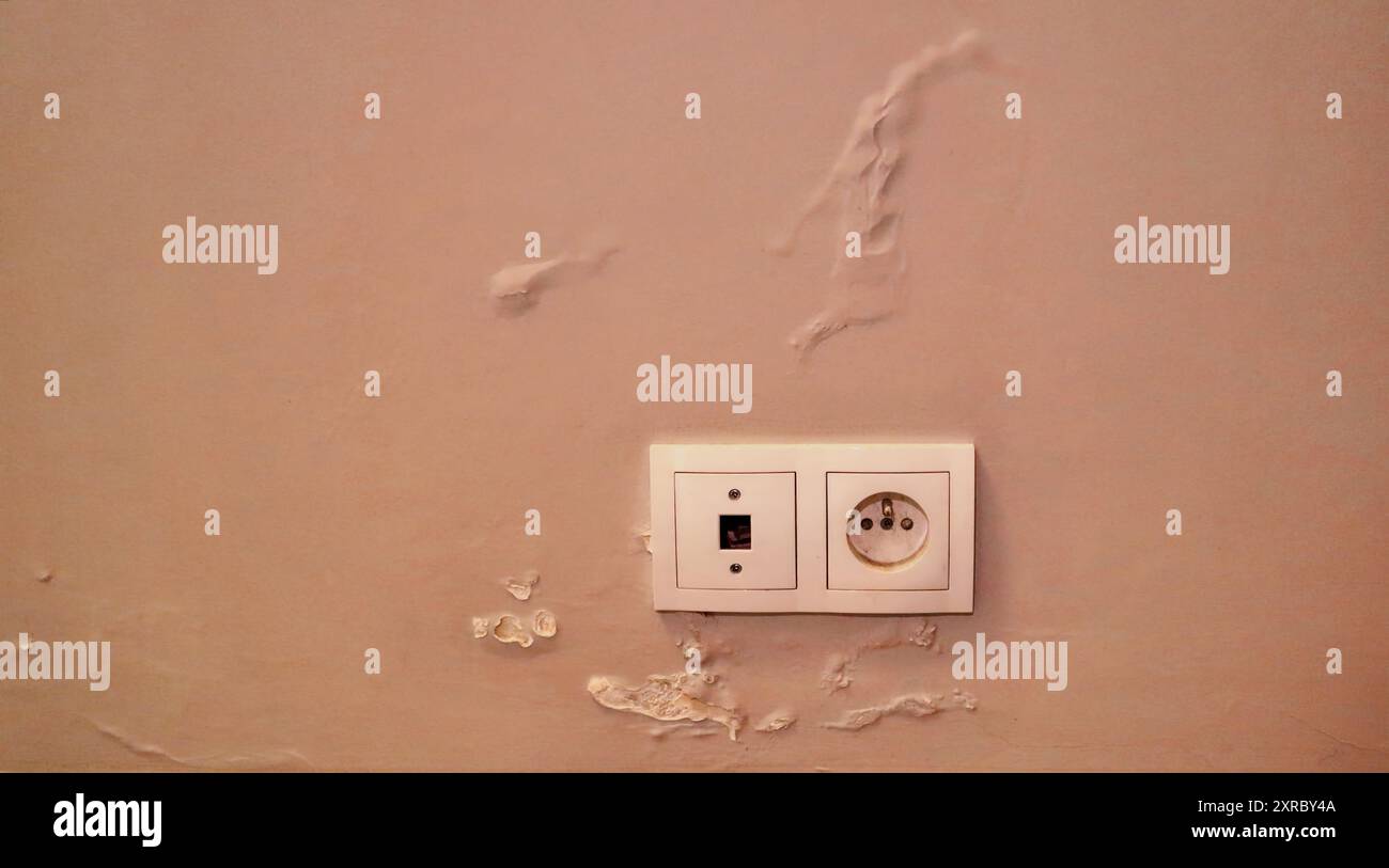 Swollen paint from water on the wall. Painted wall damaged by moisture ...