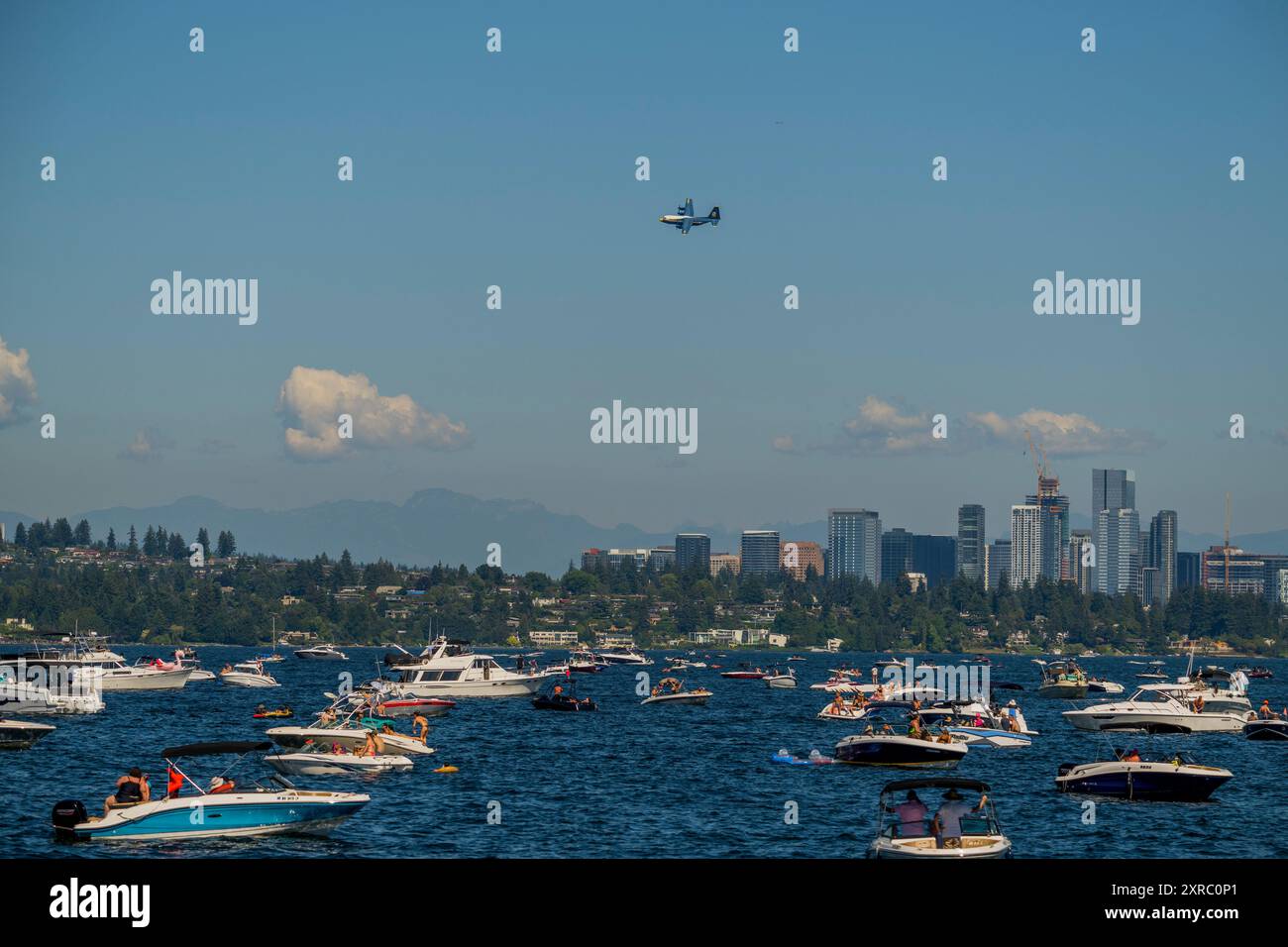 The Blue Angels C-130 plane Fat Albert flying over people in boats at ...