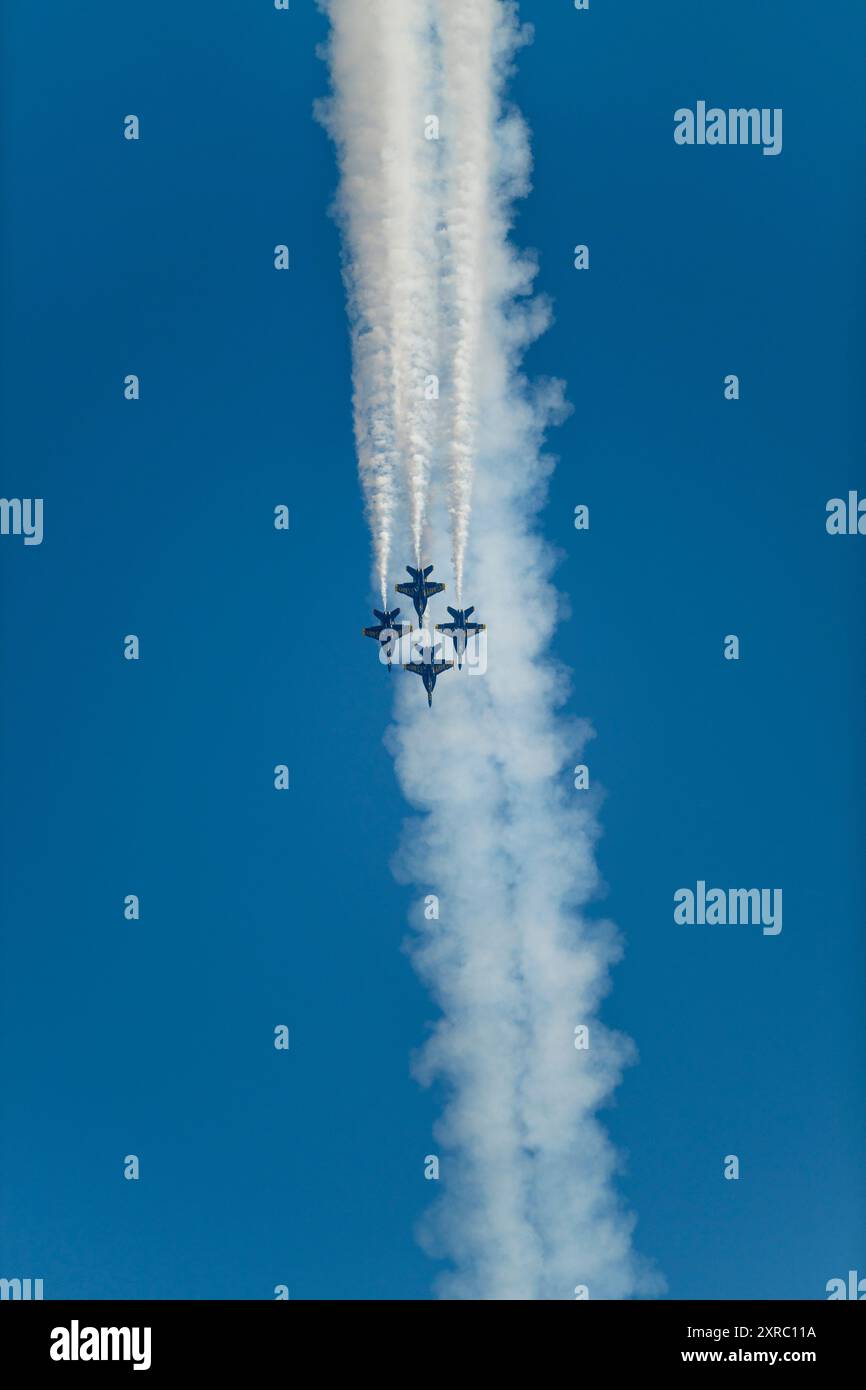 Four Blue Angels F/A-18 Hornets are flying The Diamond Roll (four ...
