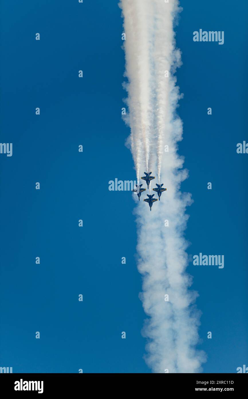 Four Blue Angels F/A-18 Hornets are flying The Diamond Roll (four ...
