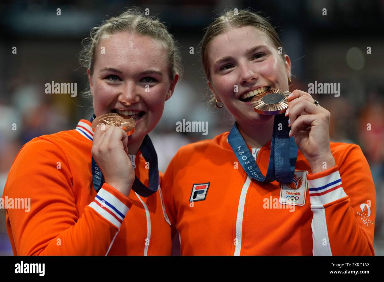 Netherlands' Mike van Der Duin, left, and Lisa van Belle, bite the ...