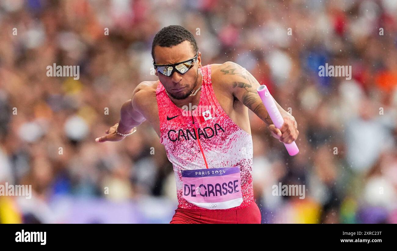 Andre de Grasse, of Canada, celebrates after winning the men's 4 x 100 ...
