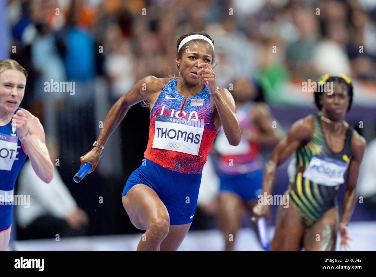 The United States' Gabrielle Thomas runs during the women's 4 x 100 ...