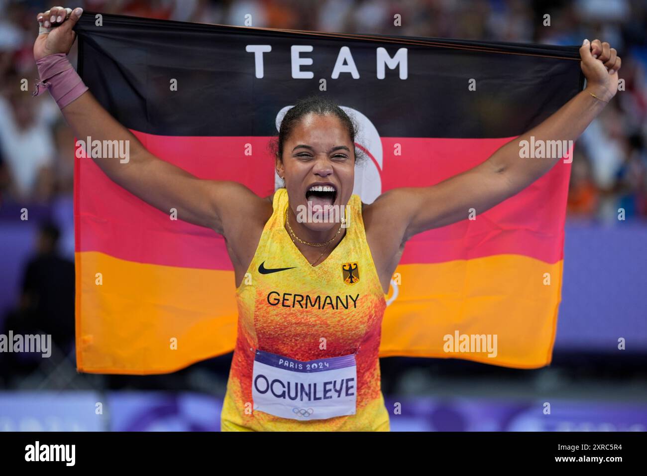 Yemisi Ogunleye, of Germany, celebrates winning the gold medal in the ...