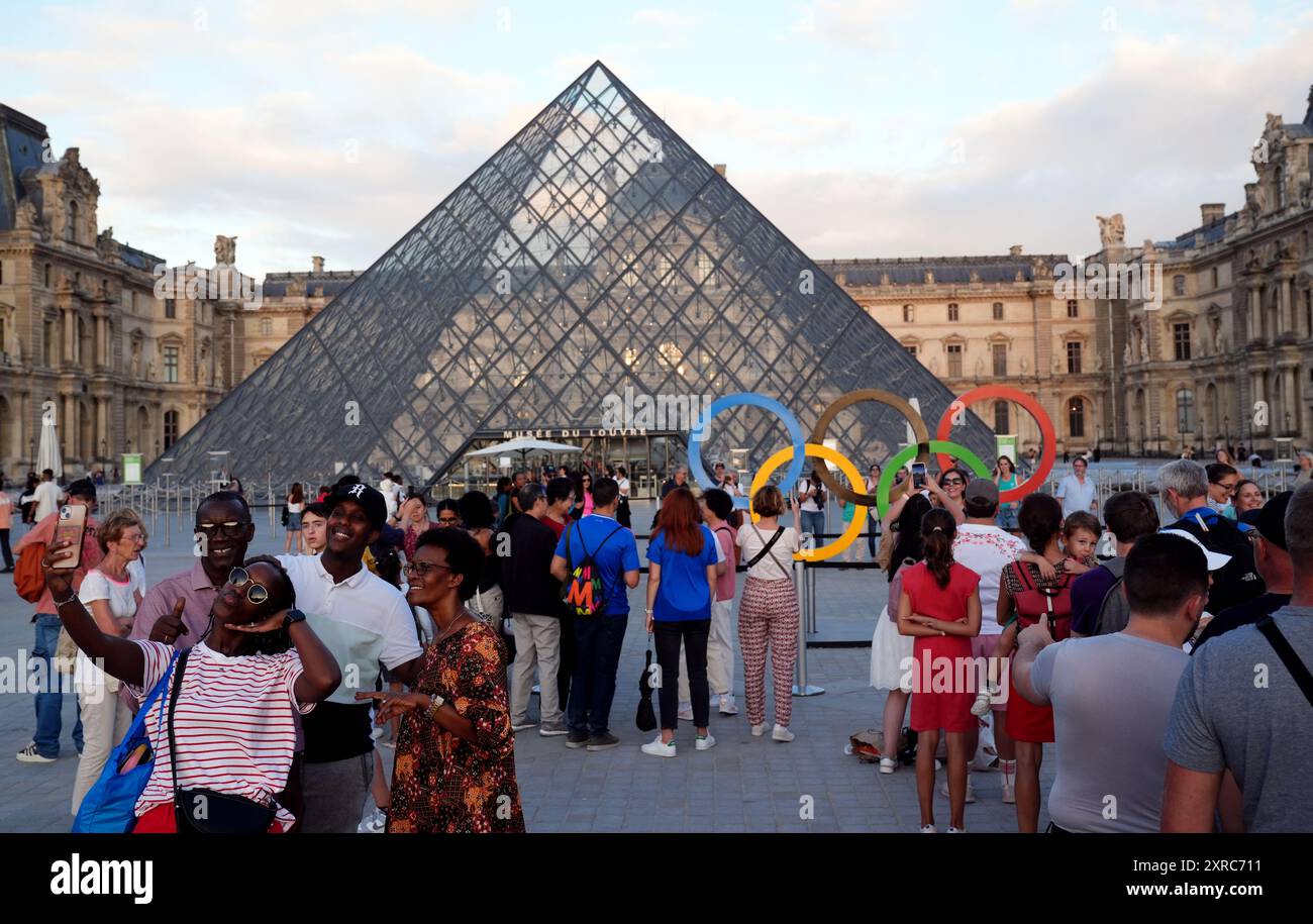 The Olympic Rings at the Louvre Pyramid on the fourteenth day of the ...