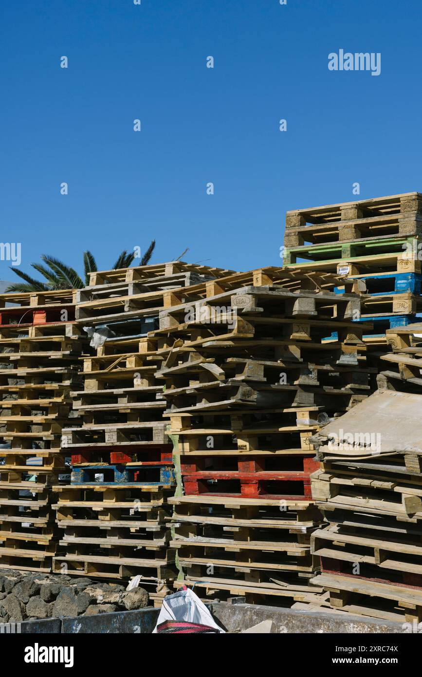Stacked pallets in a backyard in Lanzarote, Spain Stock Photo - Alamy