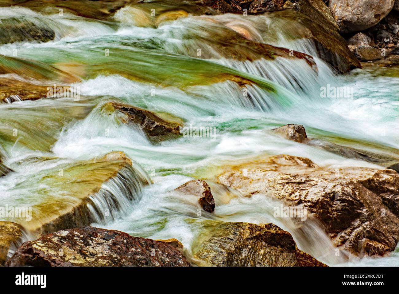 Flowing water over rock steps in a mountain stream Stock Photo - Alamy