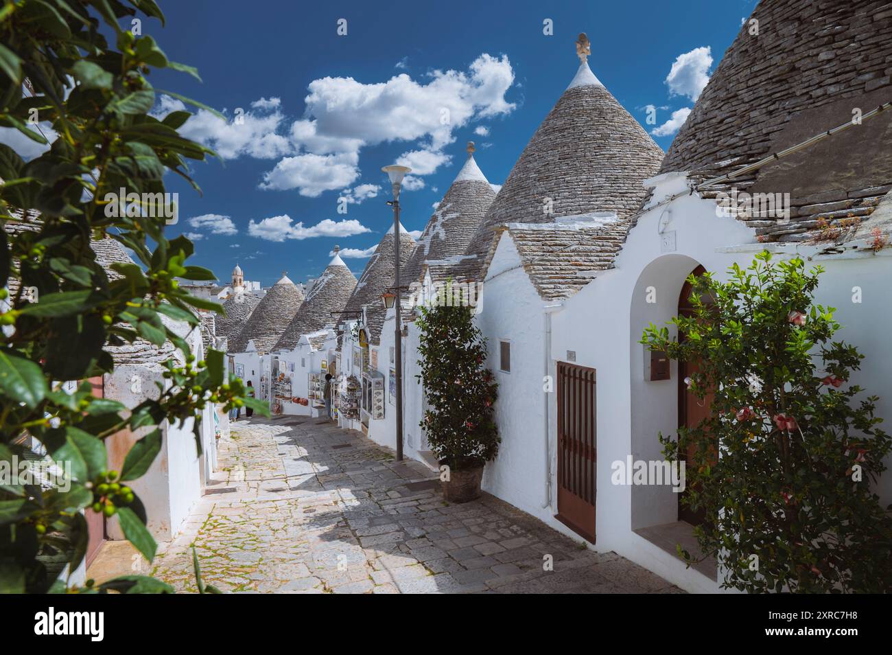 View of the romantic alleyways of Alberobello in Apulia, southern Italy ...