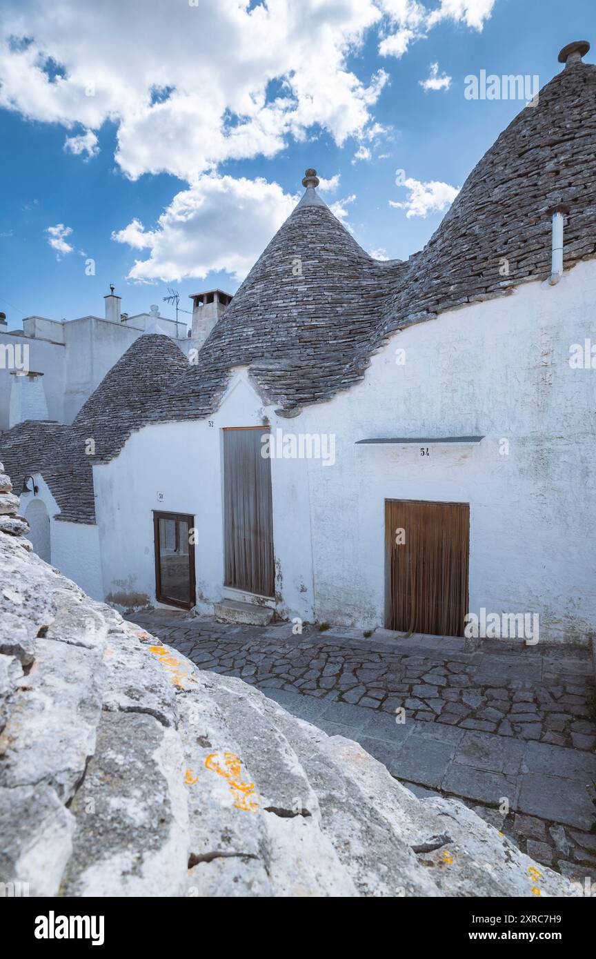 View of the romantic alleyways of Alberobello in Apulia, southern Italy ...