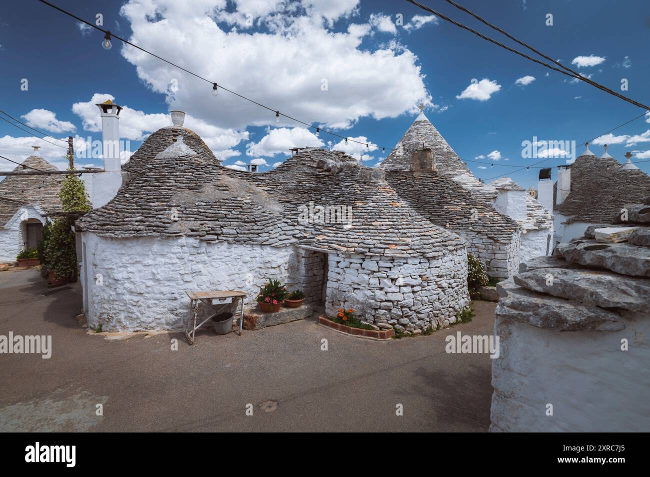 View of the romantic alleyways of Alberobello in Apulia, southern Italy ...