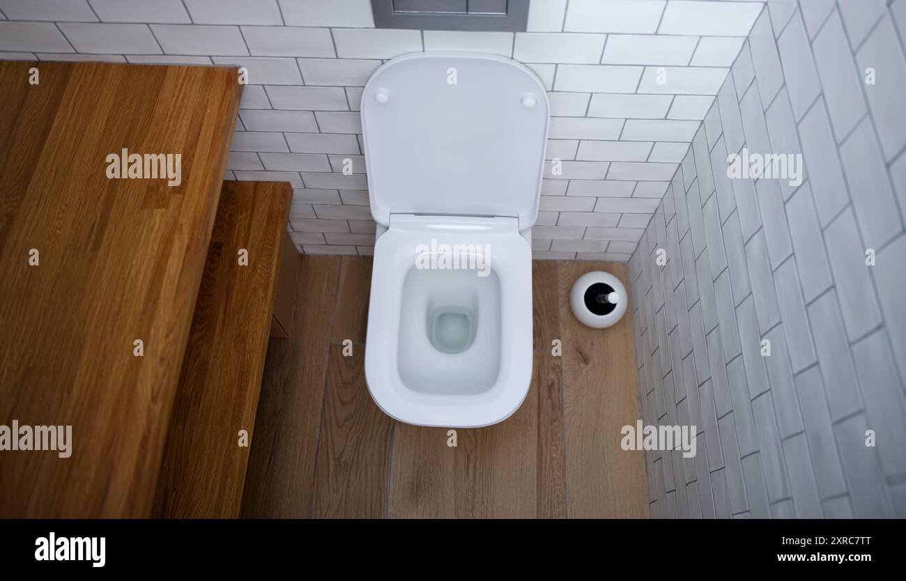 Clean toilet bowl in a wc with white tiles Stock Photo - Alamy
