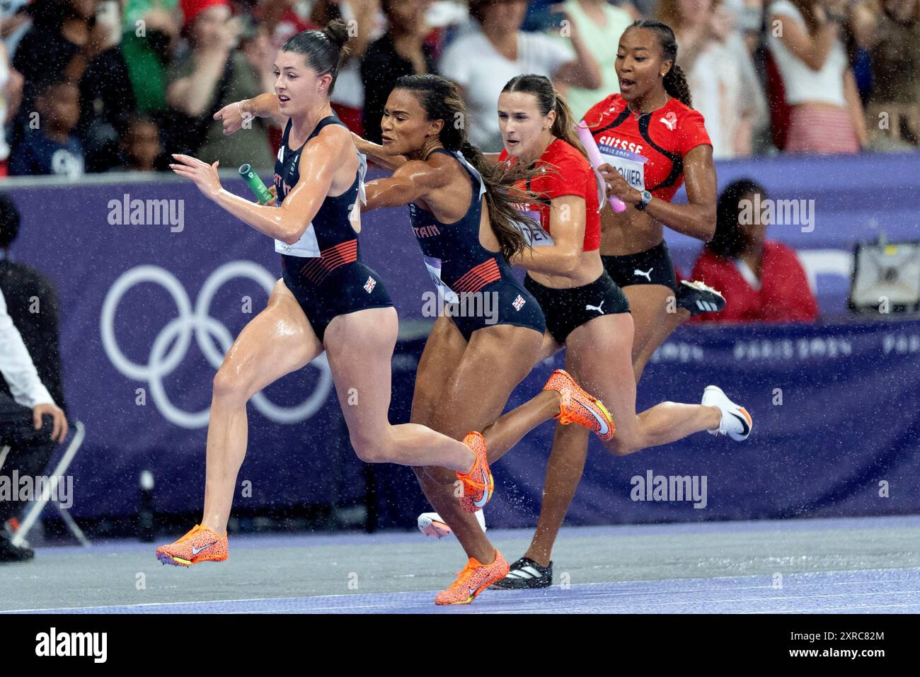 Britain's Imani Lansquiot, second from left, hands off to teammate Amy ...