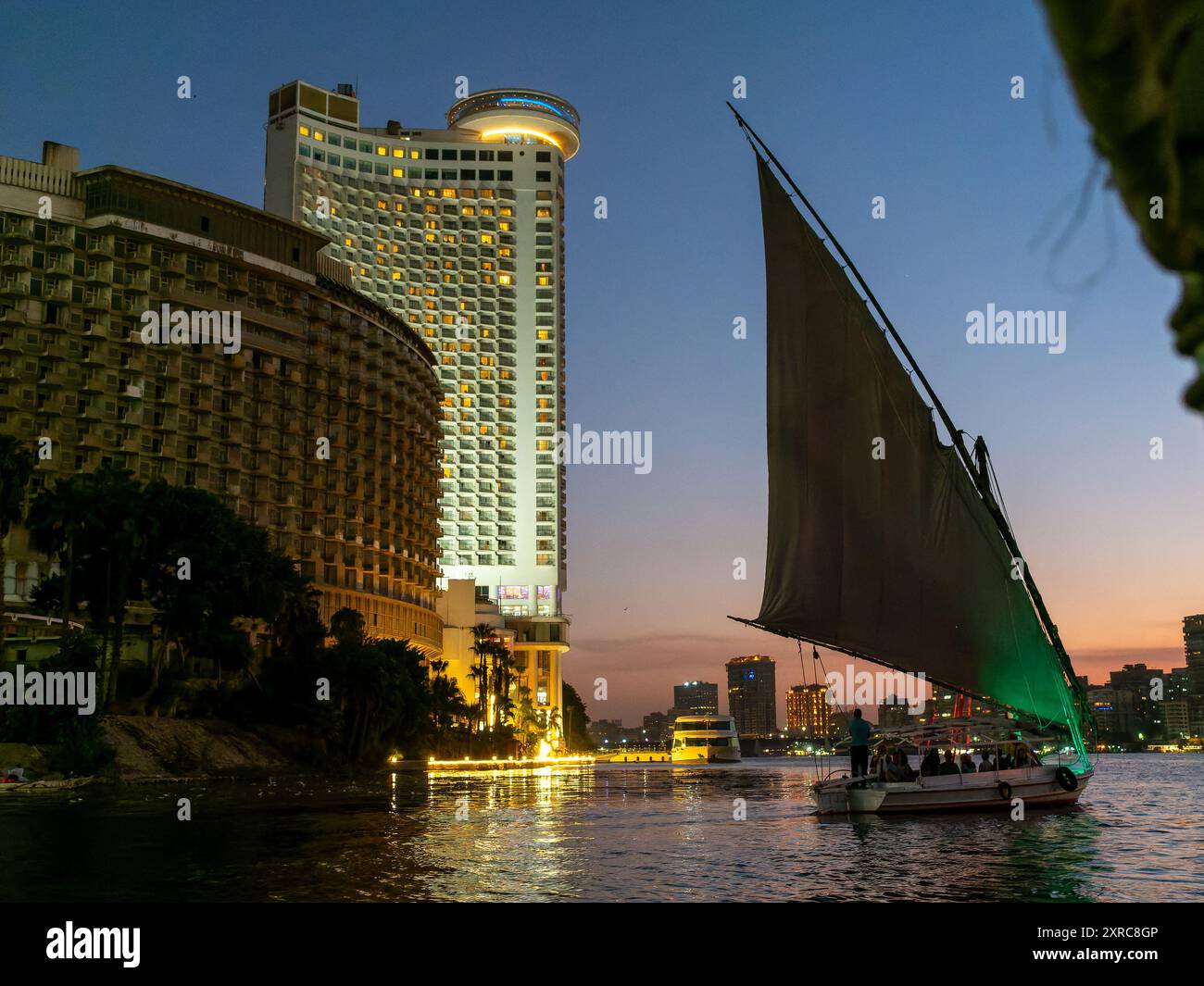 Night view of the city of Cairo from a boat on the Nile River, Egypt ...