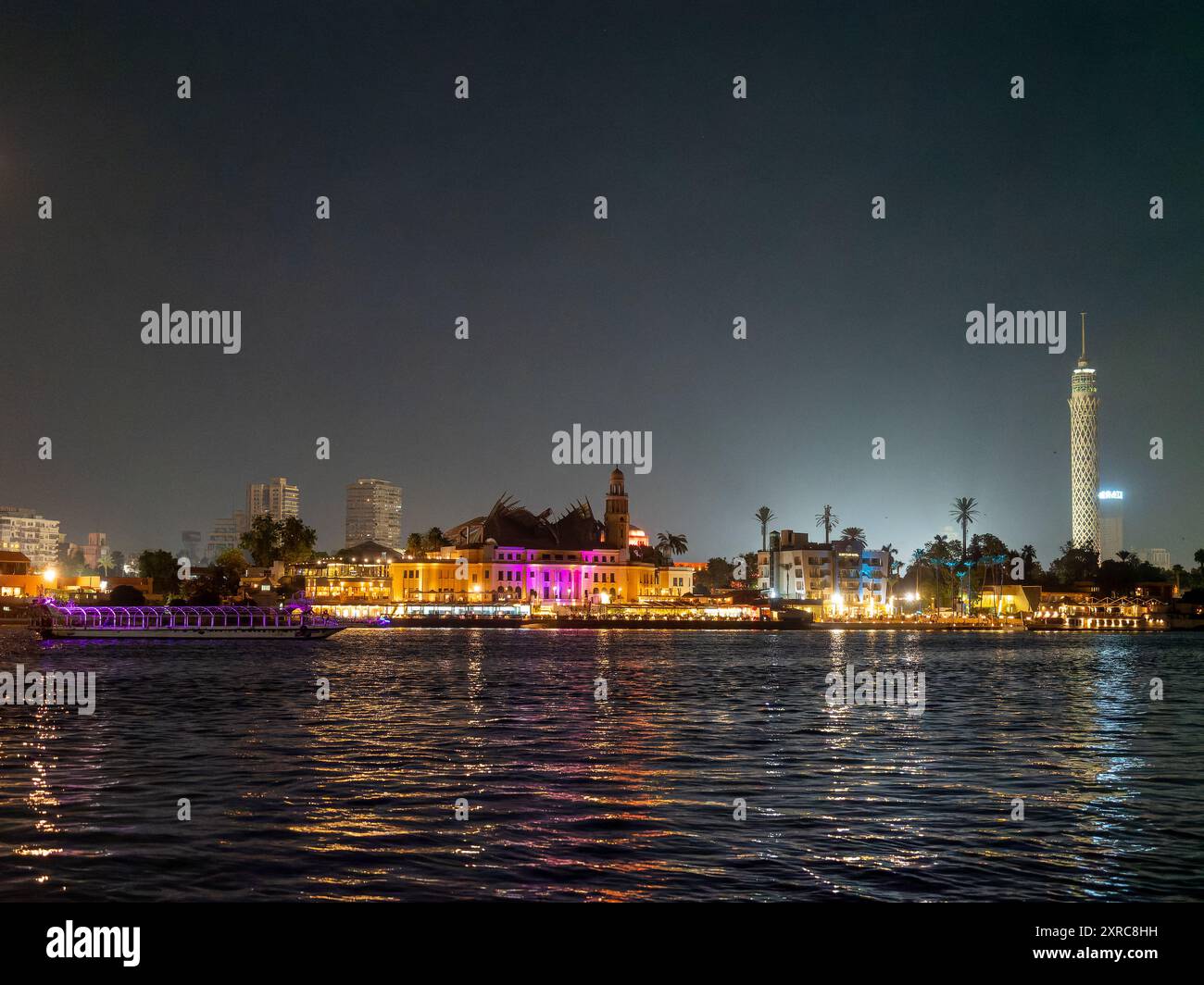 Night view of the city of Cairo from a boat on the Nile River, Egypt ...