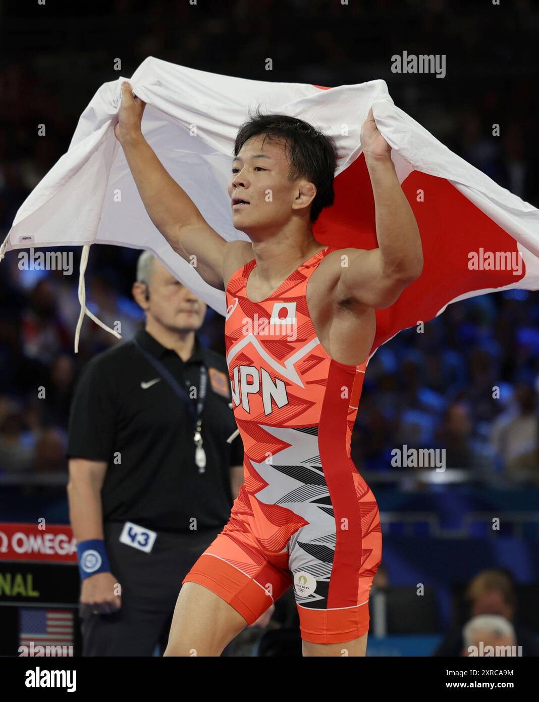 apan's HIGUCHI Rei wrapped in a national flag celebrates after winning ...