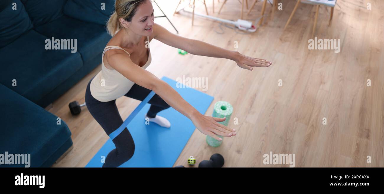 Woman squats sofa hi-res stock photography and images - Alamy
