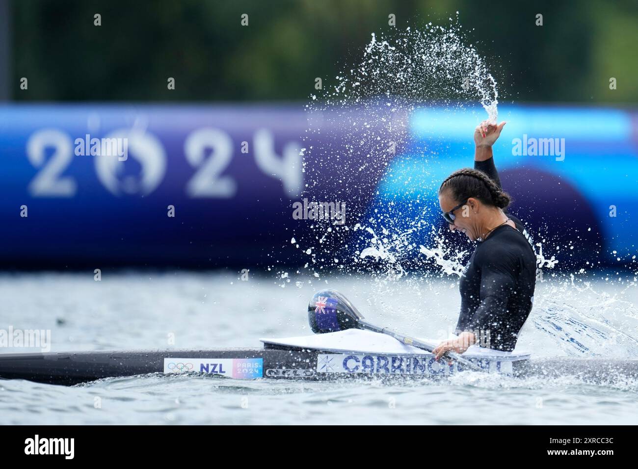 New Zealand's Lisa Carrington celebrates winning gold with teammate ...