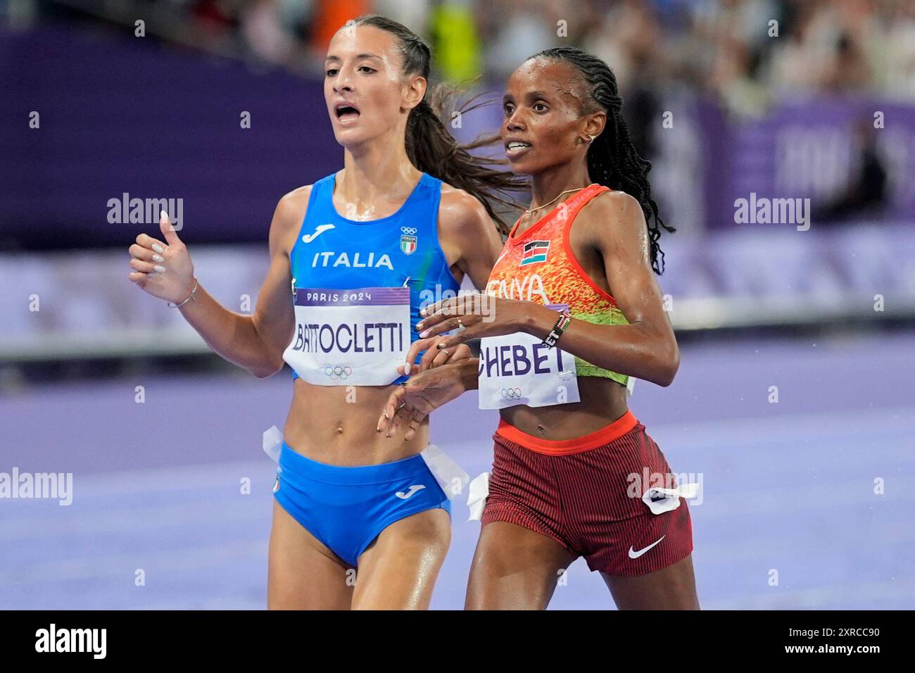 Beatrice Chebet, right, of Kenya, wins the women's 10,000-meter final ...