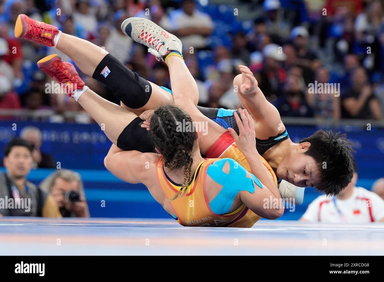 Brazil's Giullia Penalber and China's Kexin Hong compete during their ...