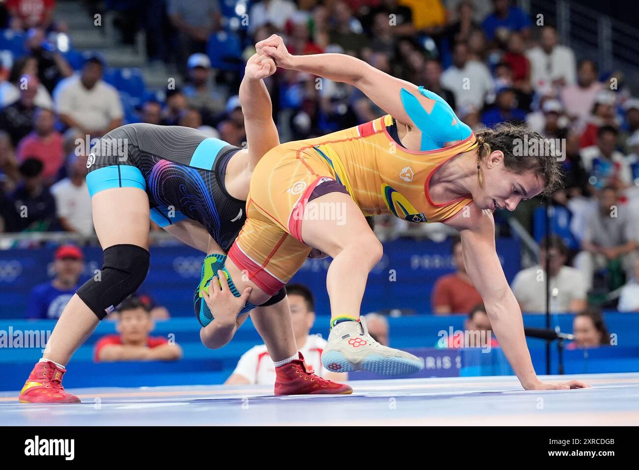 Brazil's Giullia Penalber and China's Kexin Hong compete during their ...