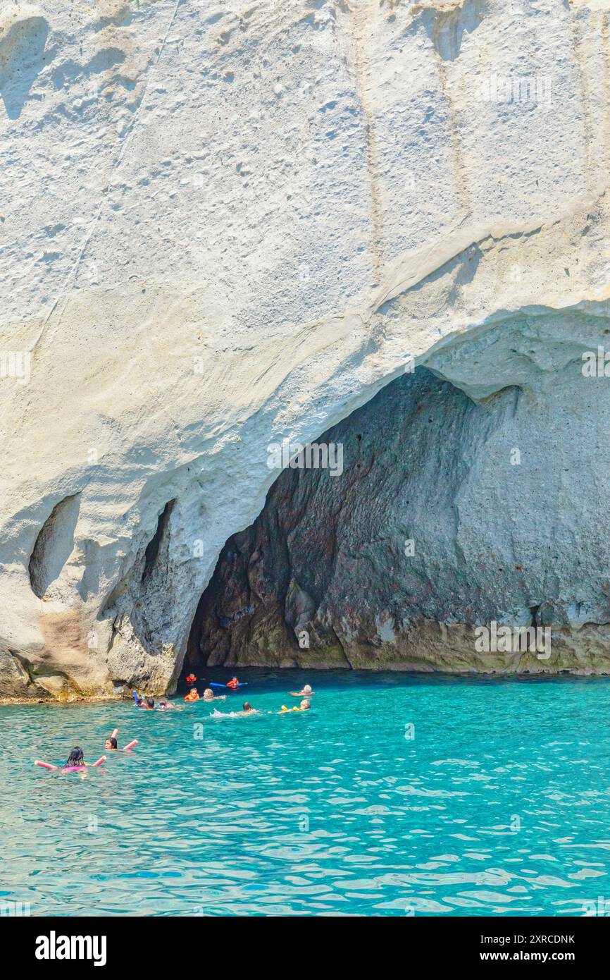 People swimming near sea cave, Kleftiko, Milos Island, Cyclades Islands ...